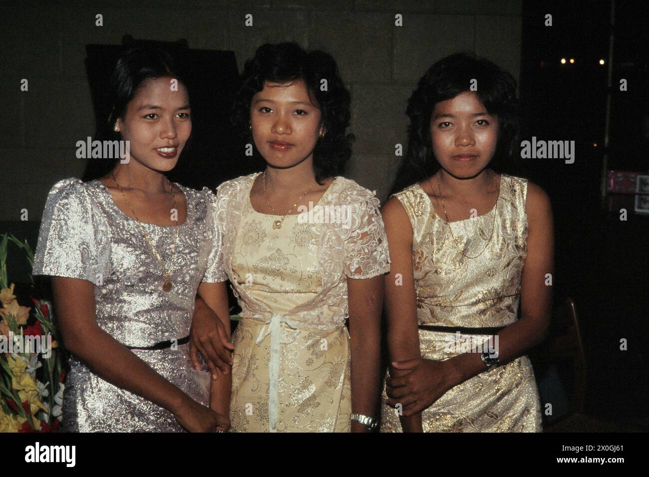 Three women in shining clothes in a hotel in Saraburi Stock Photo - Alamy