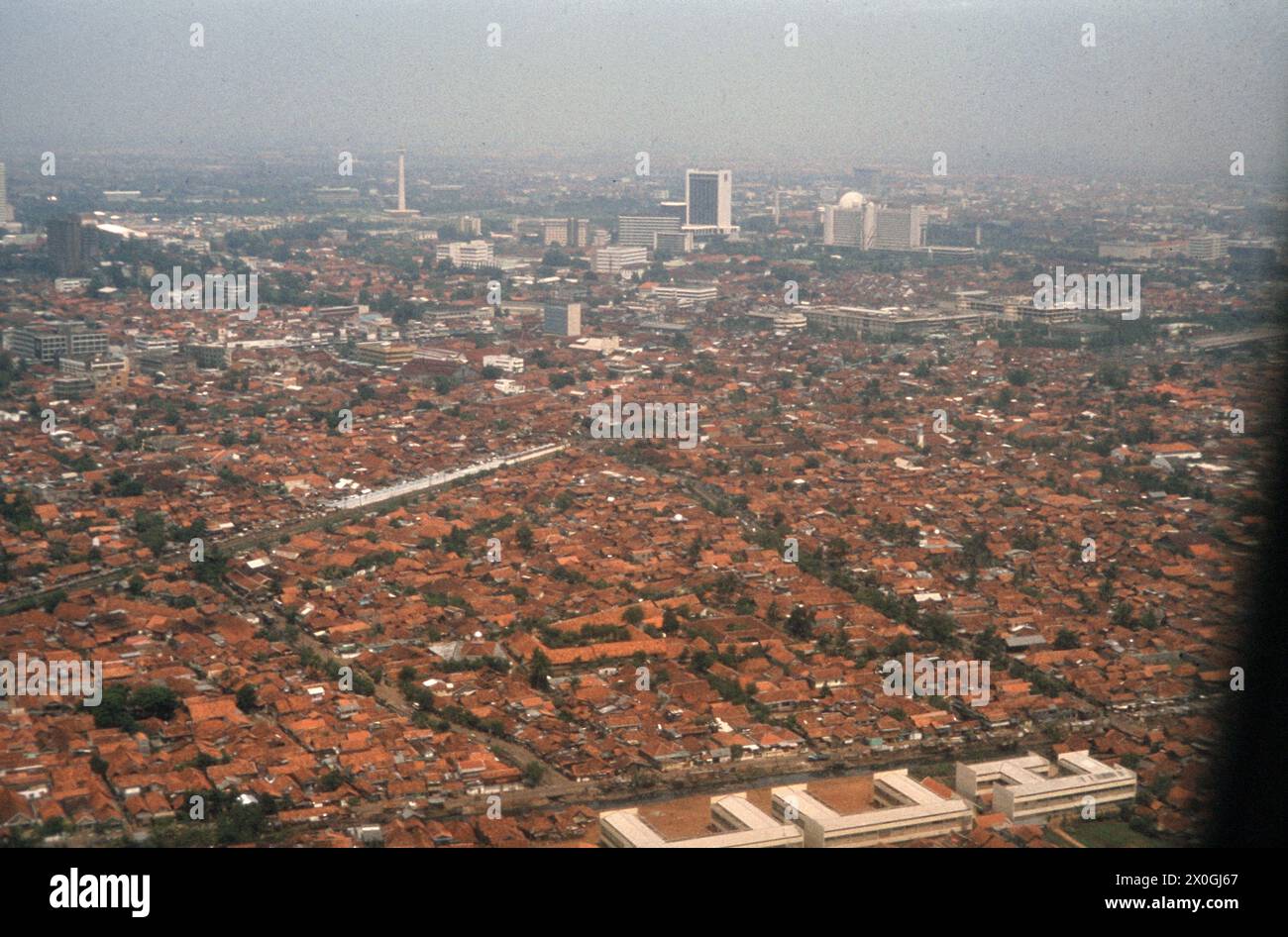 View from the landing plane of the rooftops and skyscrapers of Jakarta ...
