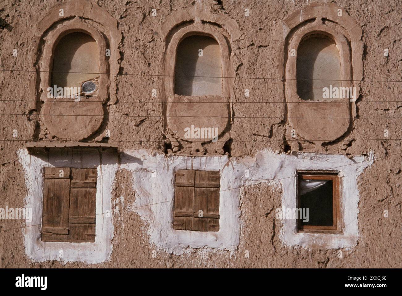 Alabaster windows on a house front in the Yemeni village of Rauda ...