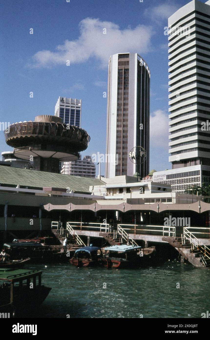 "The ""Sampan Harbour"" and modern banking and commercial buildings on ...