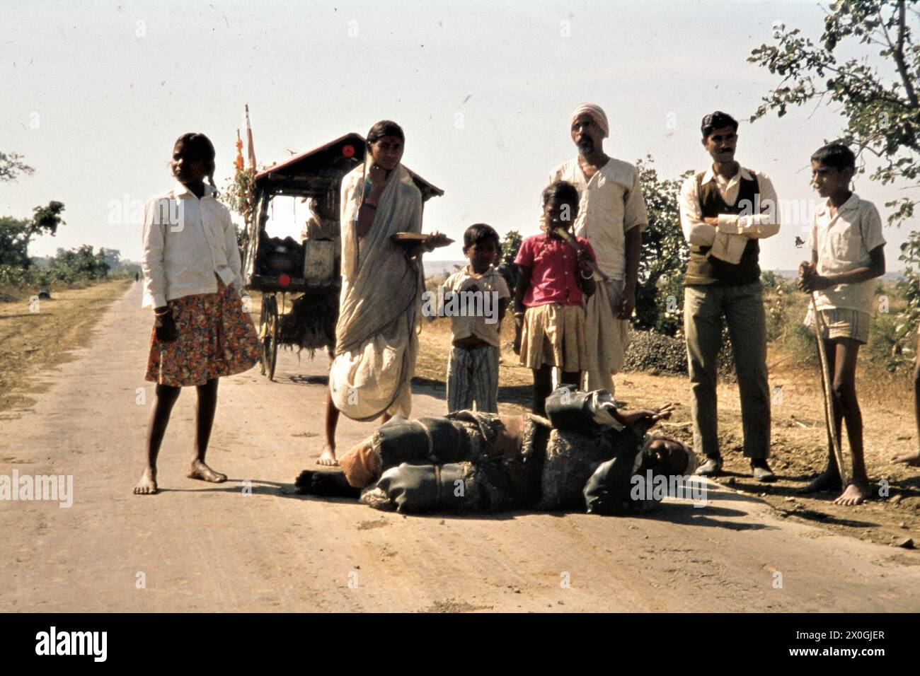 A pilgrim who has been rolling along the road from Baroda to Bemares ...