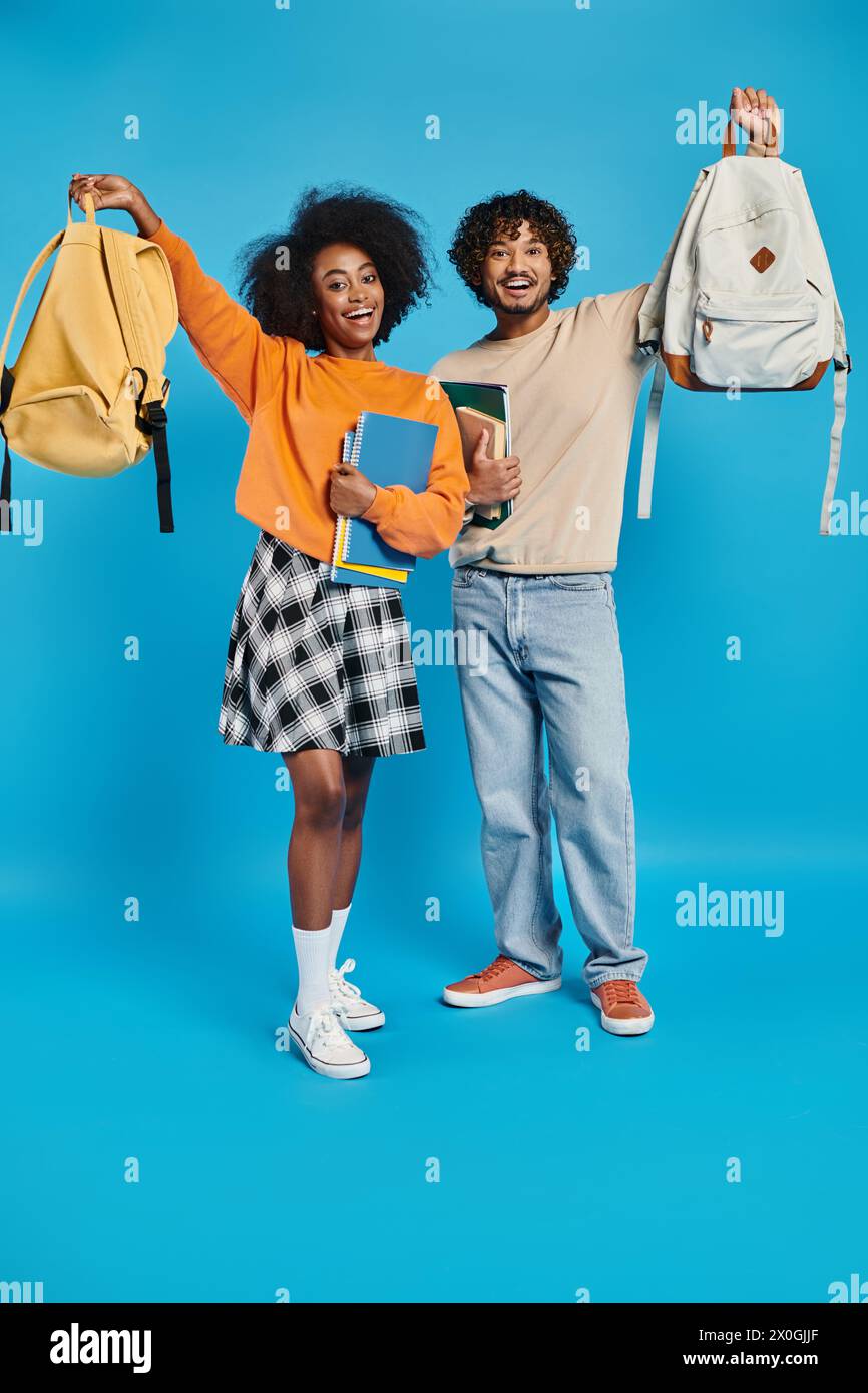 Two friends, an African American woman and a man, stand side by side ...