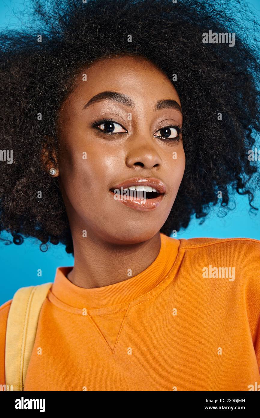 An African American college student with a voluminous afro posing ...