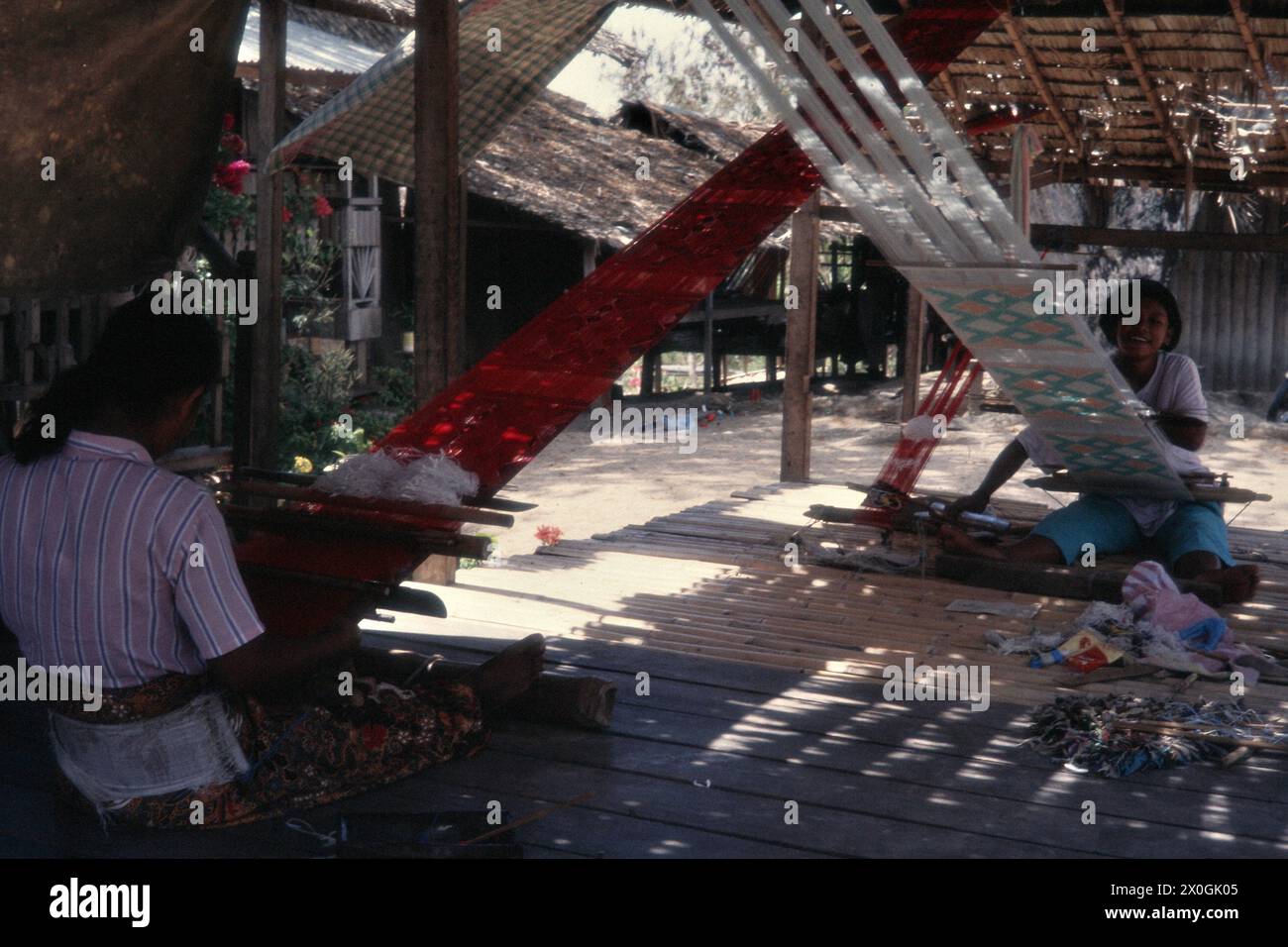 Two female refugees from Sulu Lake in a weaving village in Yakan ...