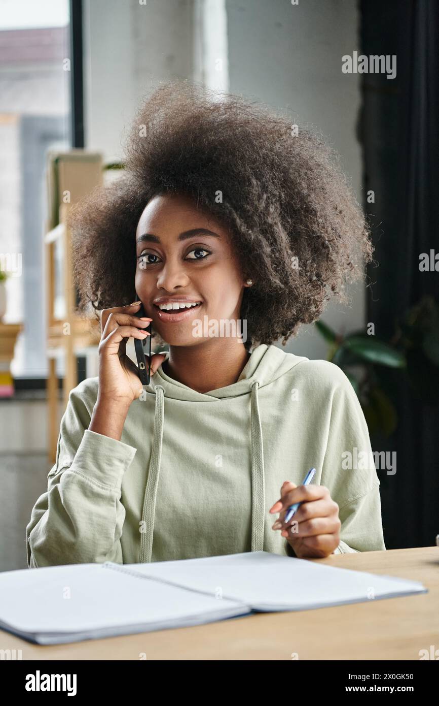 A woman from diverse backgrounds conversing on a cell phone in a shared ...