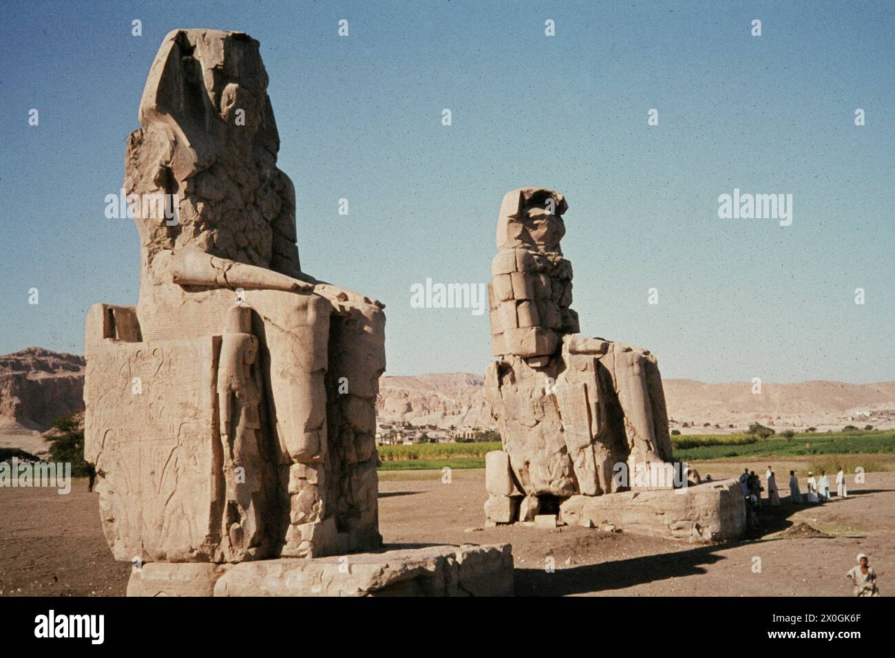 The two seated memorial colossuses of the former mortuary temple of ...