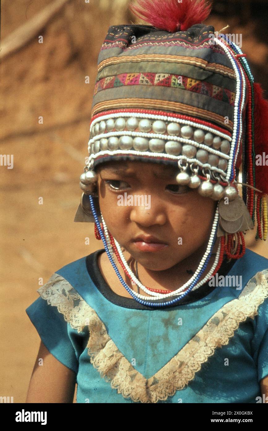 A child of the ethnic group Meo (Hmong) in traditional clothes in a ...