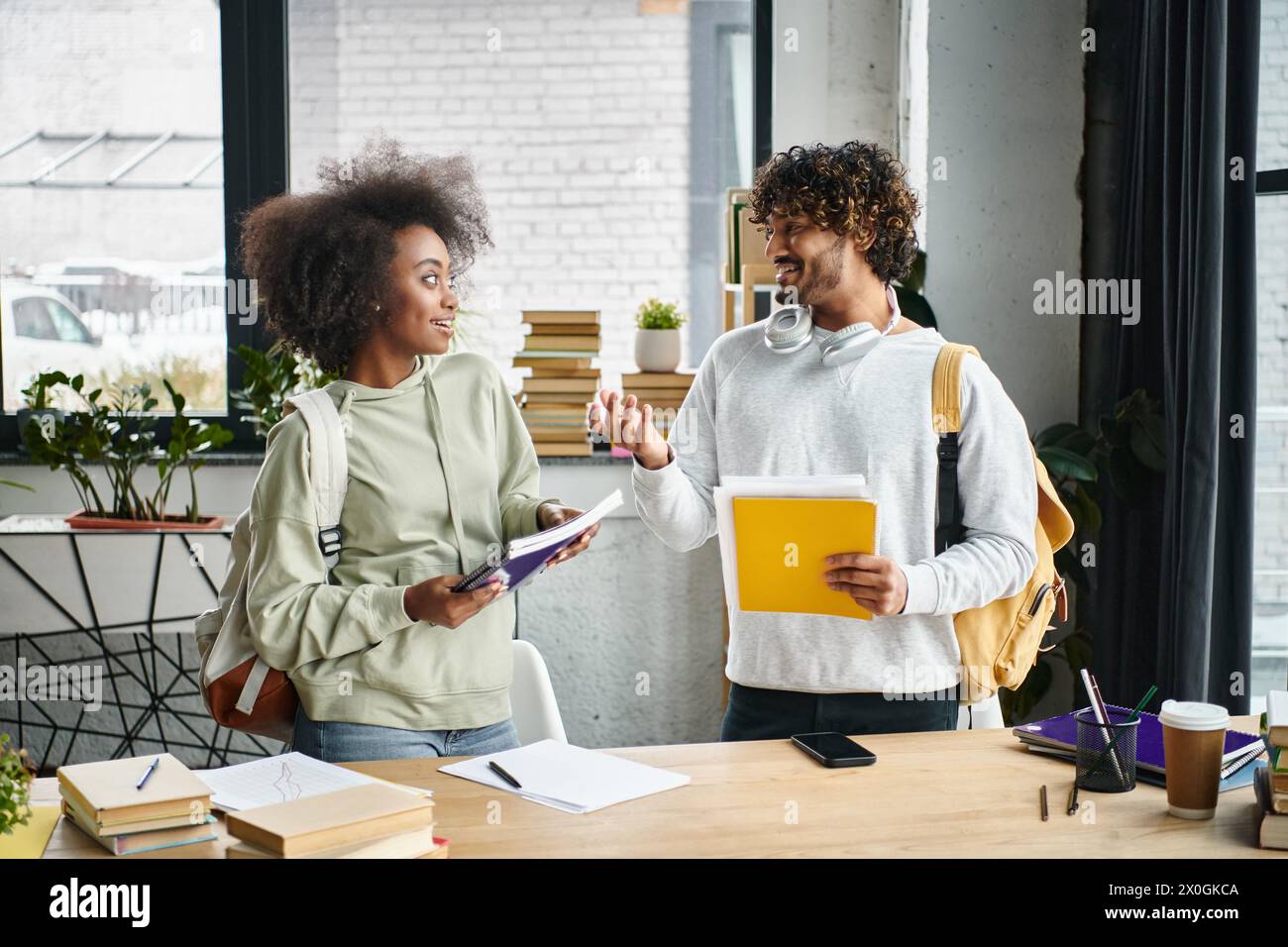 A man and a woman of different cultural backgrounds stand together in a ...