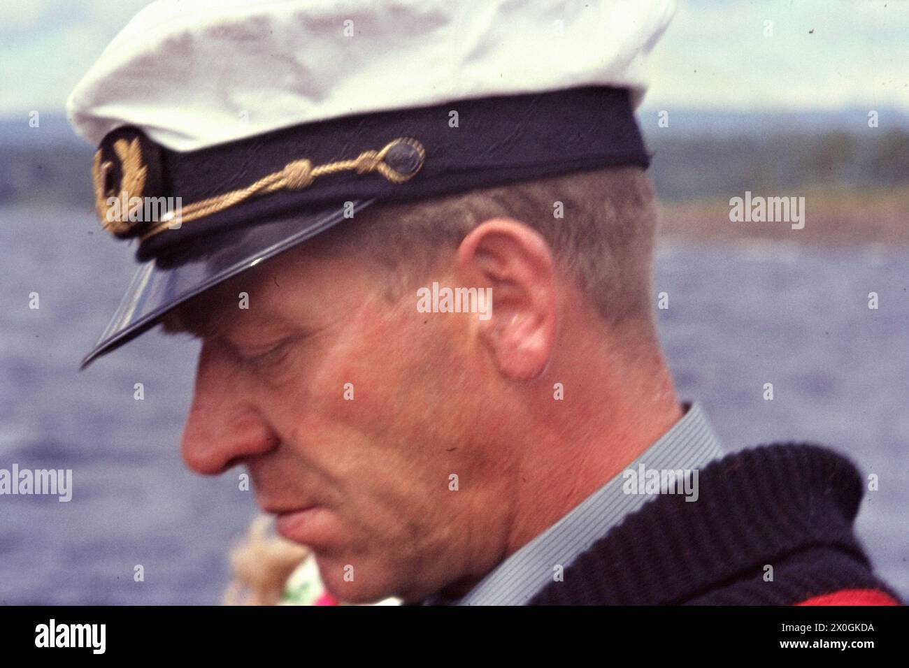 The captain of a fishing trawler in the Oslofjord off Oslo. [automated ...