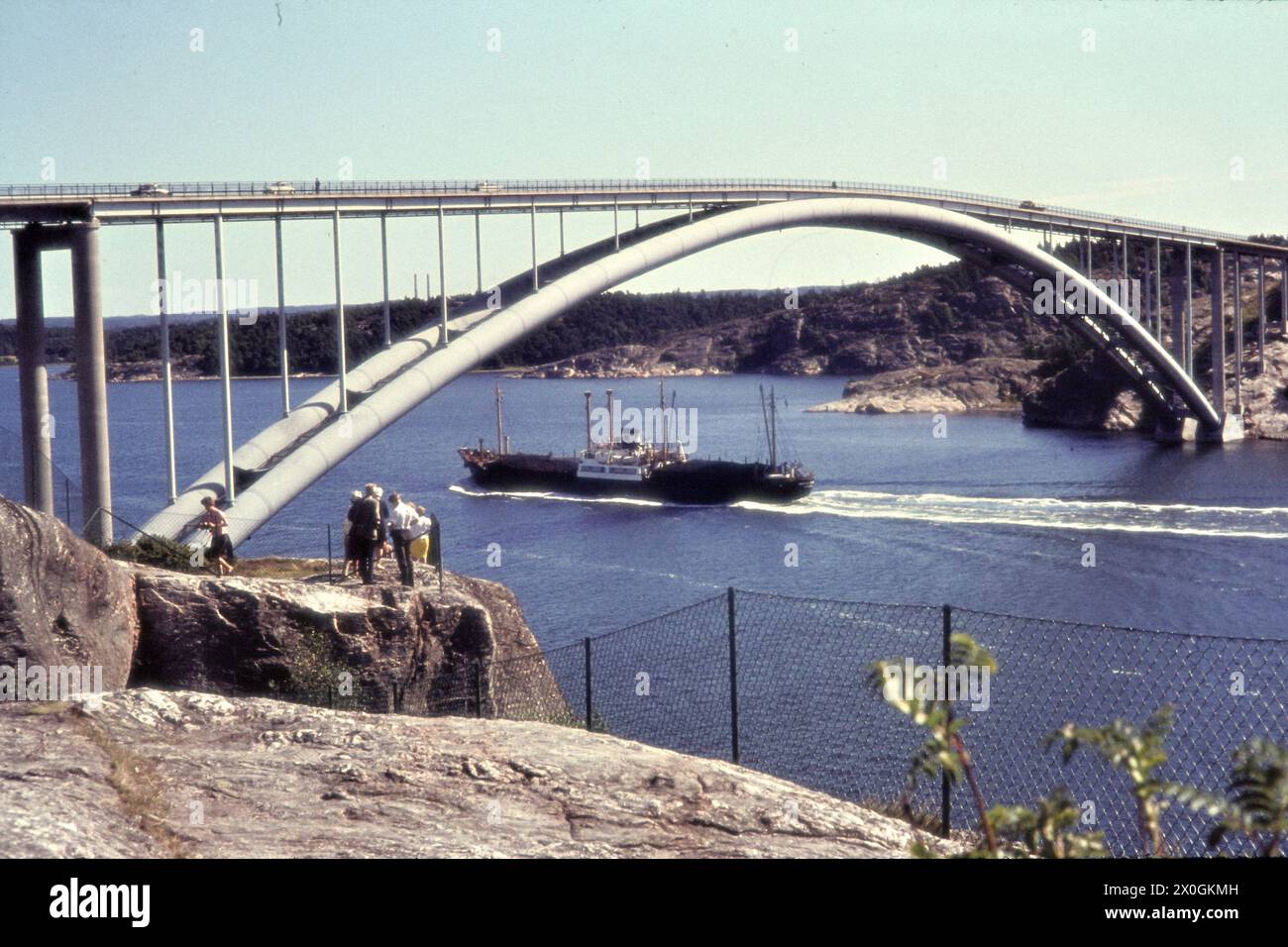 A freighter under a modern pipe arch bridge with a span of 278 metres ...