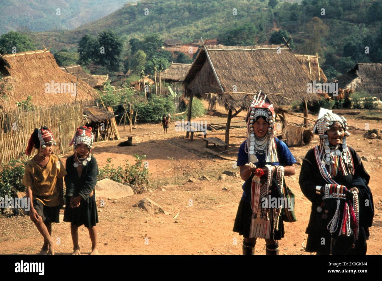 Women of the ethnic group Akha with traditional headwear in front of ...