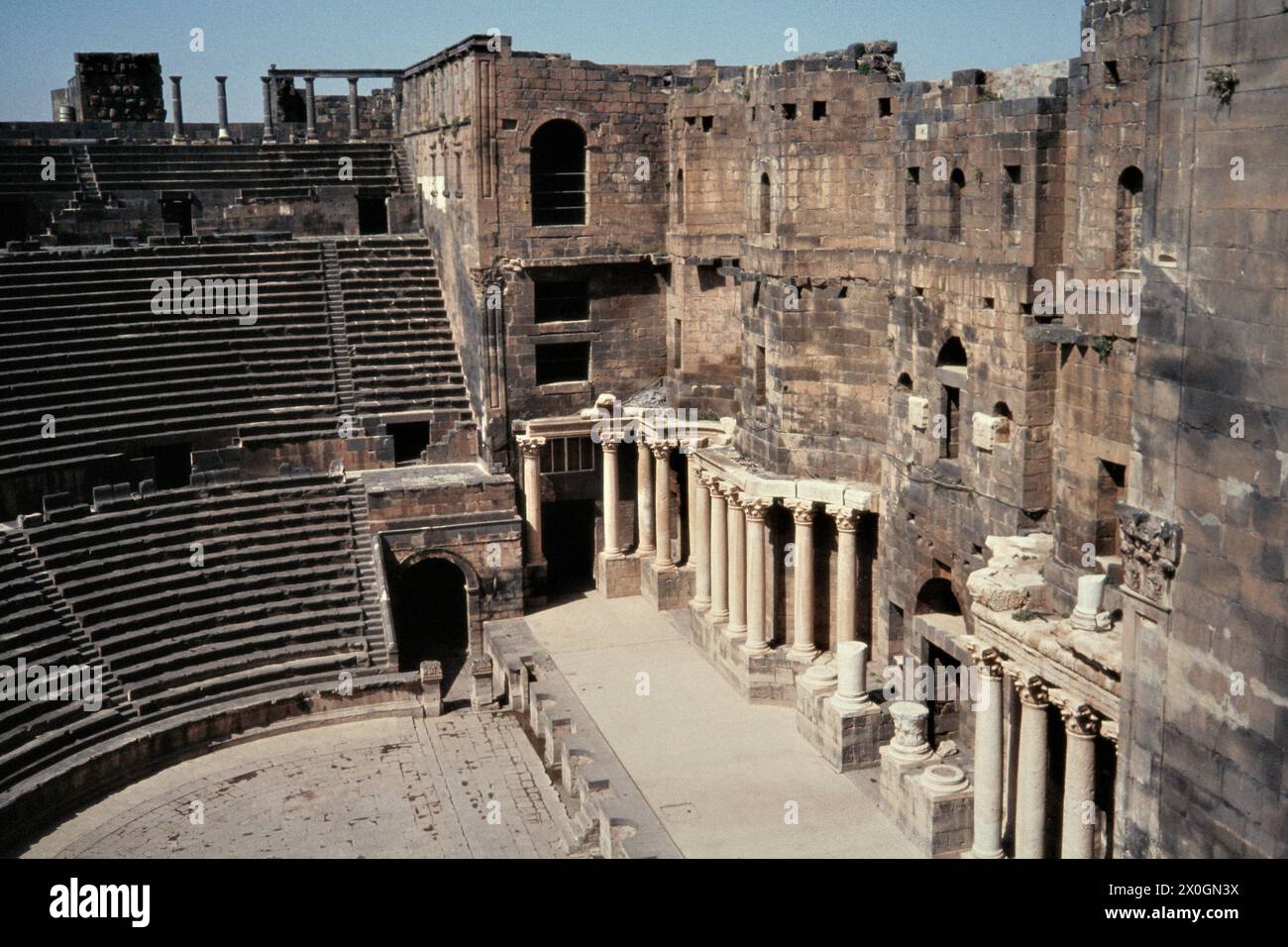 View of the columns of the stage of a Roman theater in Bosra Stock ...