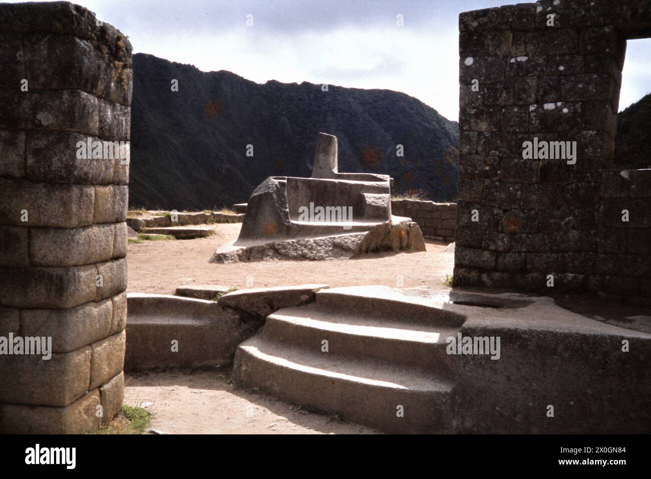 A sundial among the remains of the ruined city of Machu Picchu ...