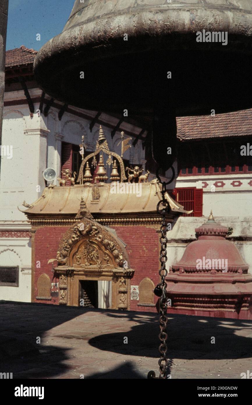 The Golden Gate with bells and a detailed image of the Hindu goddess ...