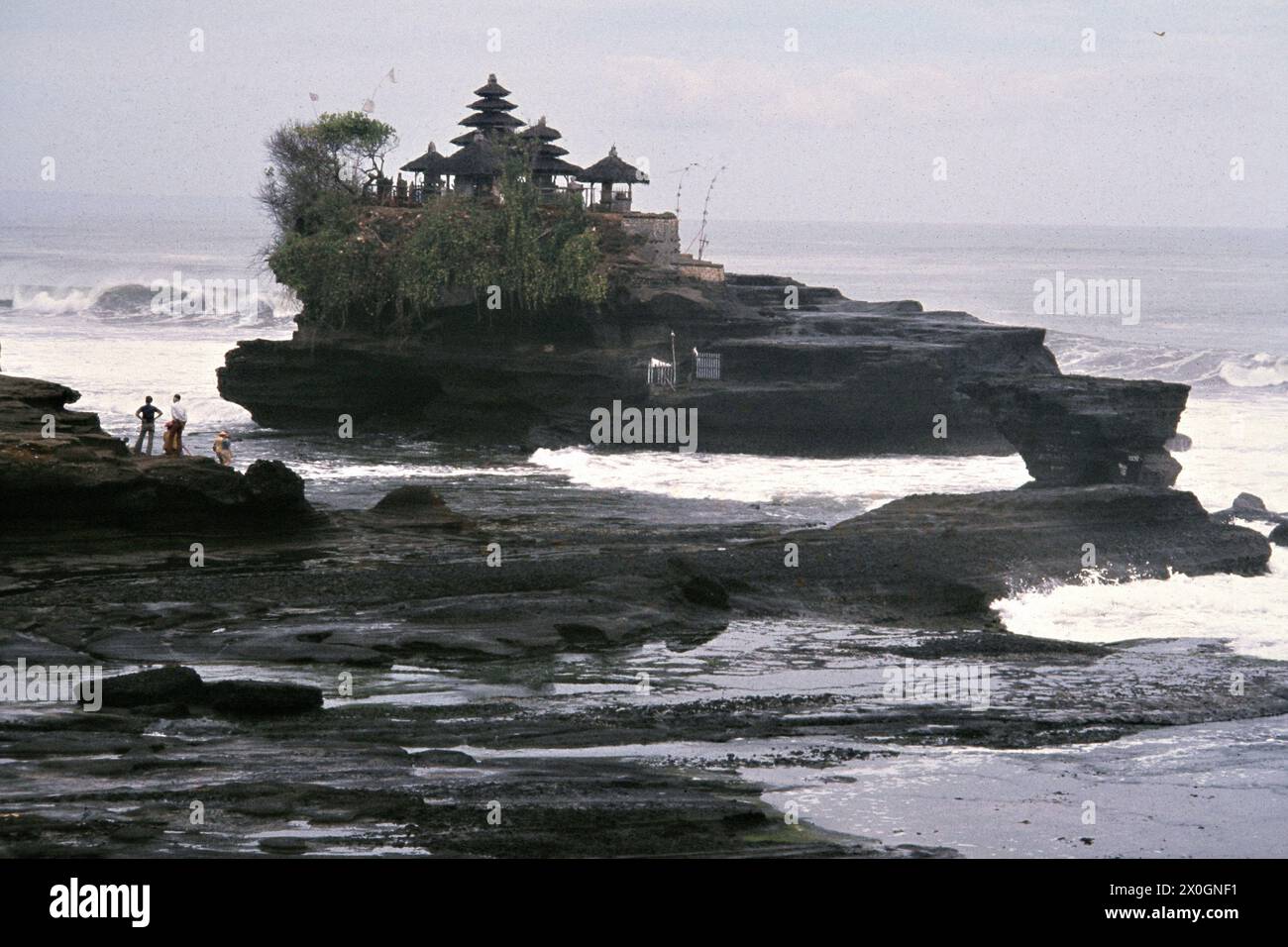 The island of Tanah Lot with its 16th century temple on the coast off ...