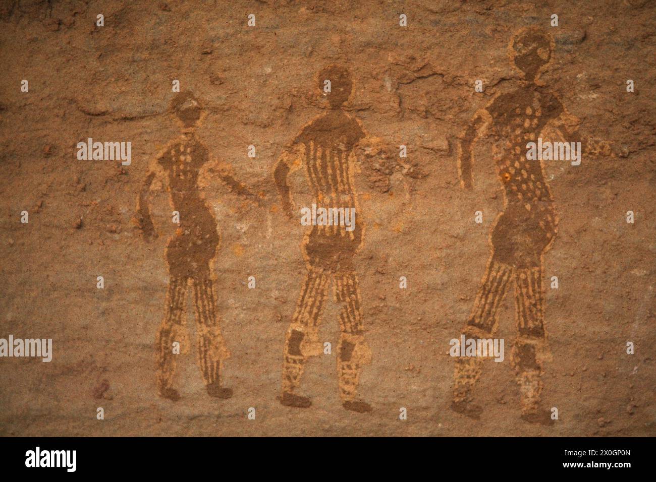 Rock painting with three men in Sefar, Tassili n'Ajjer Stock Photo - Alamy