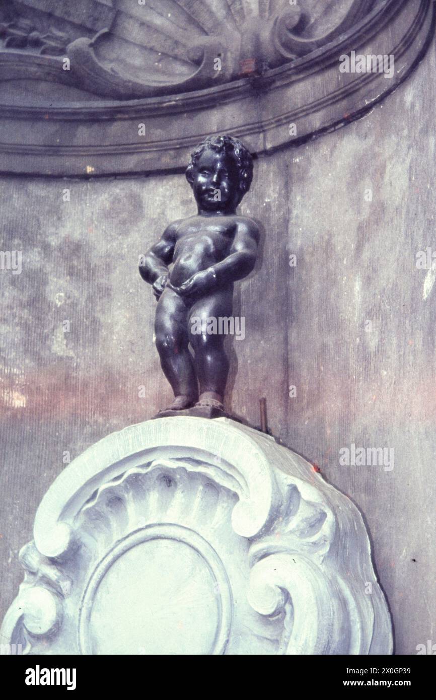 The Manneken Pis figure above a water basin in the old town of Brussels ...