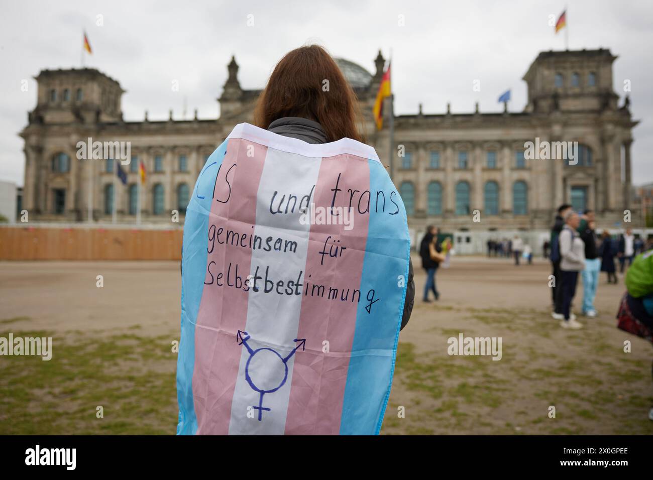 Berlin, Germany. 12th Apr, 2024. A participant stands in front of the ...