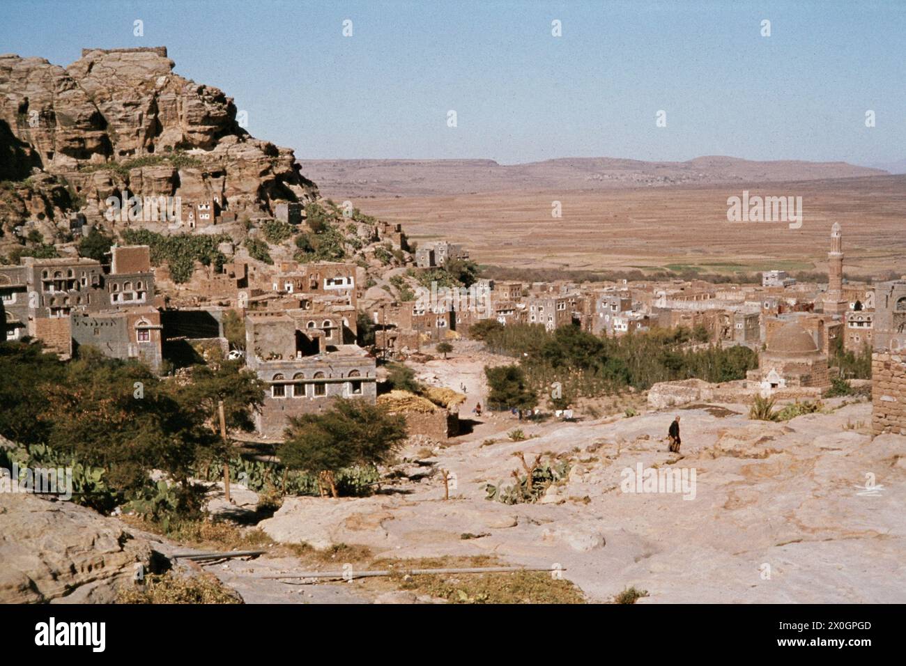The village of Shimba, built on a rock face on the edge of a desert in ...