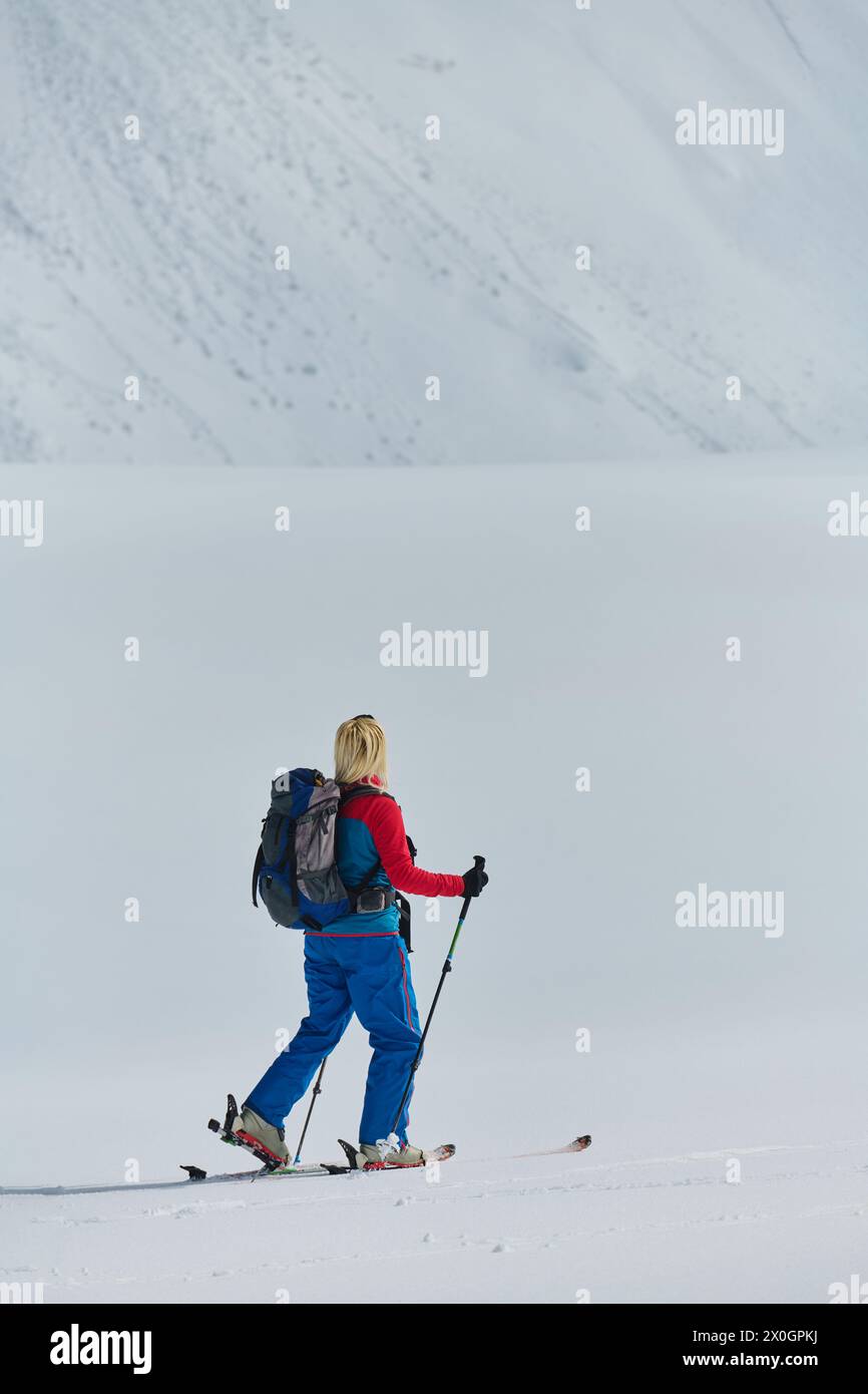A Female Mountaineer Ascends the Alps with Backcountry Gear Stock Photo ...