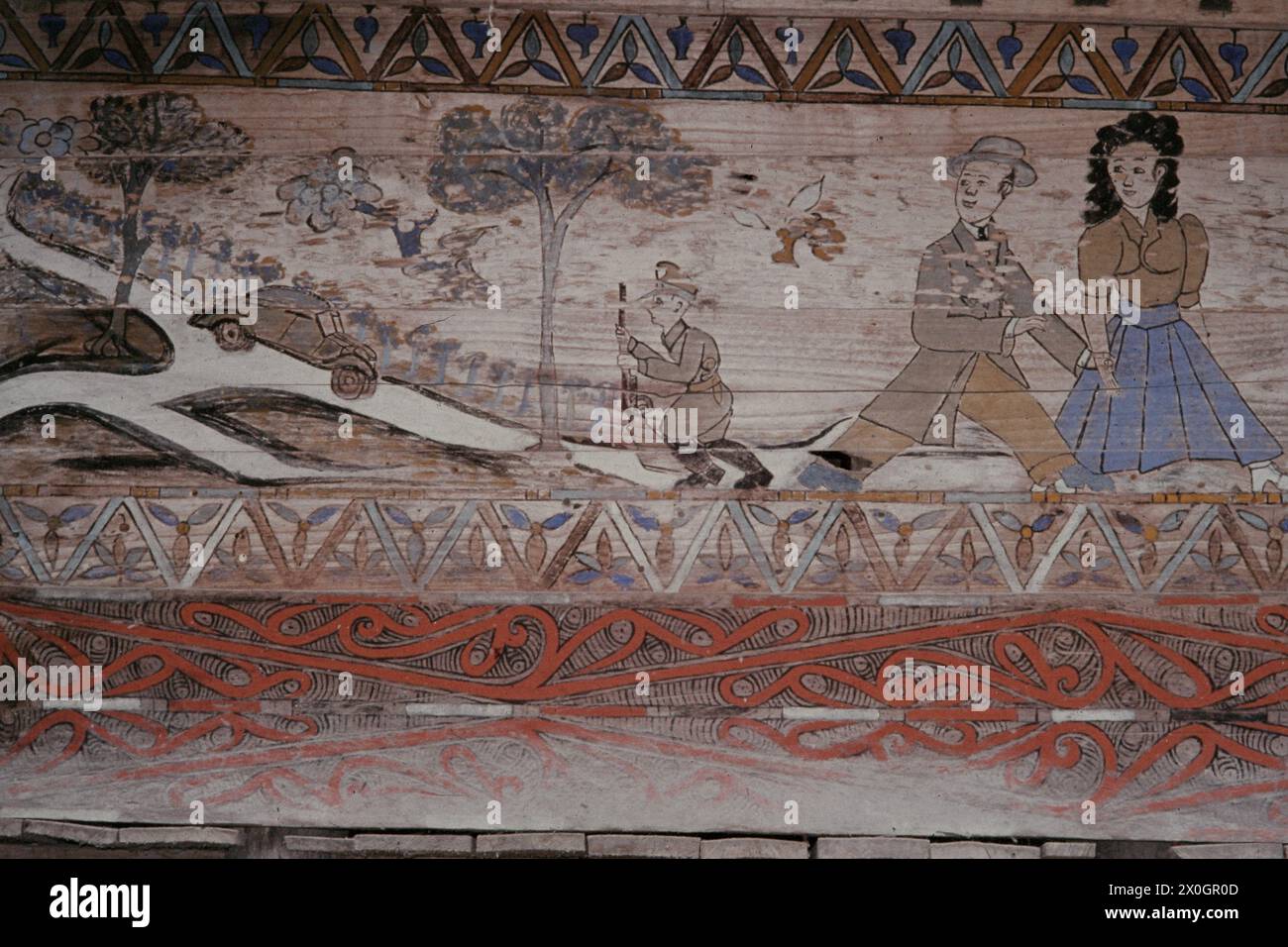 A painting on the ledge of a Toba-Batak house in Sulawesi shows a ...