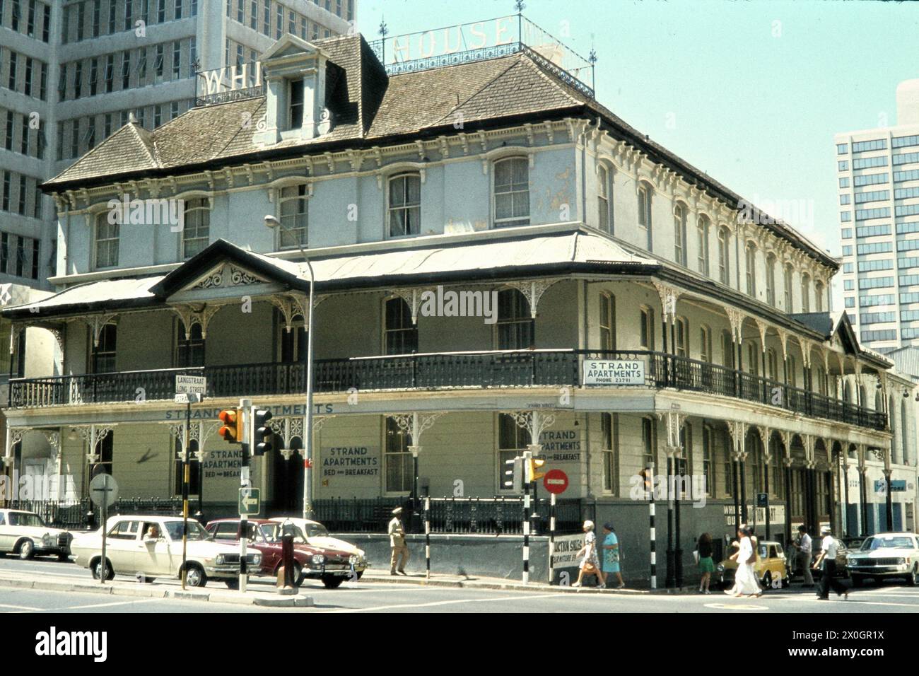 An old house on the corner of Strand and Loop Street between high-rise ...