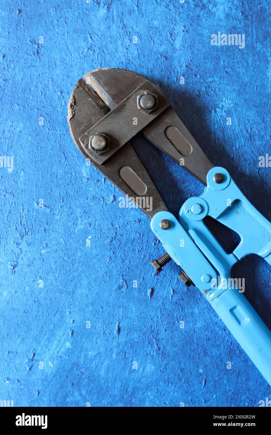 Close up photo of handyman tool on textured blue background with space ...