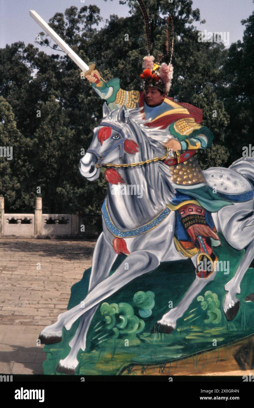 A Chinese tourist behind an old fairytale figure in the Dingling Tomb ...