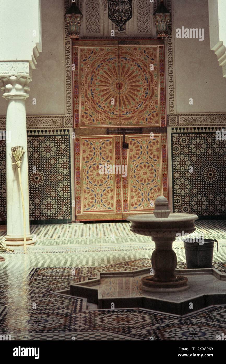 A decorated wooden door in the innermost courtyard of the burial mosque ...