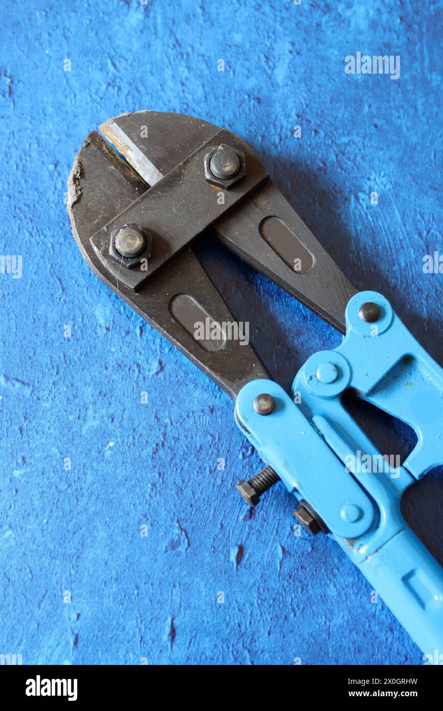 Close up photo of handyman tool on textured blue background with space ...