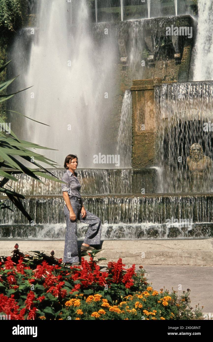 "A tourist wearing bell-bottoms in front of the Fontana dell'Organo ...