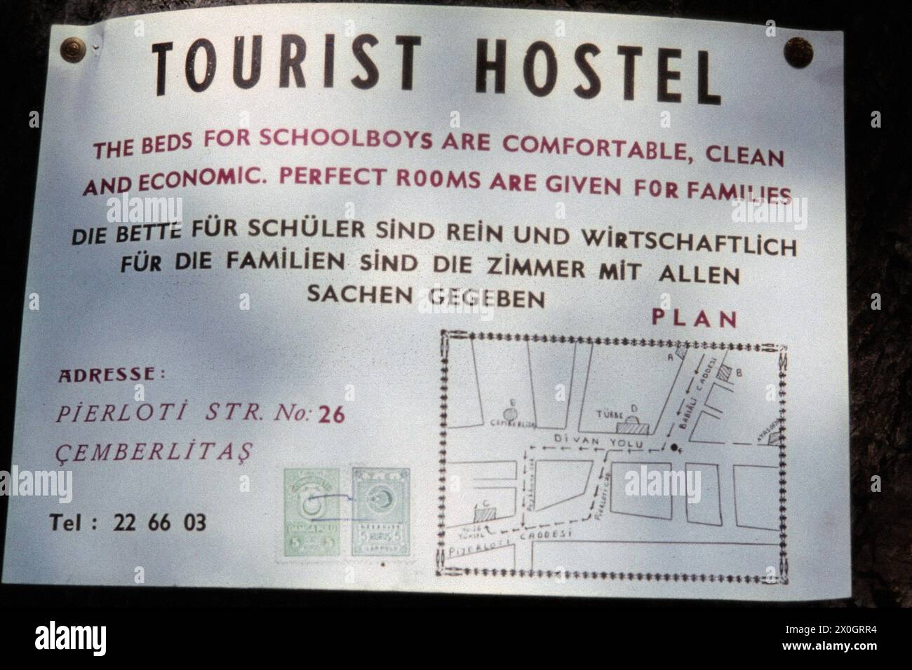 The advertising sign of a hostel in English and German language in ...