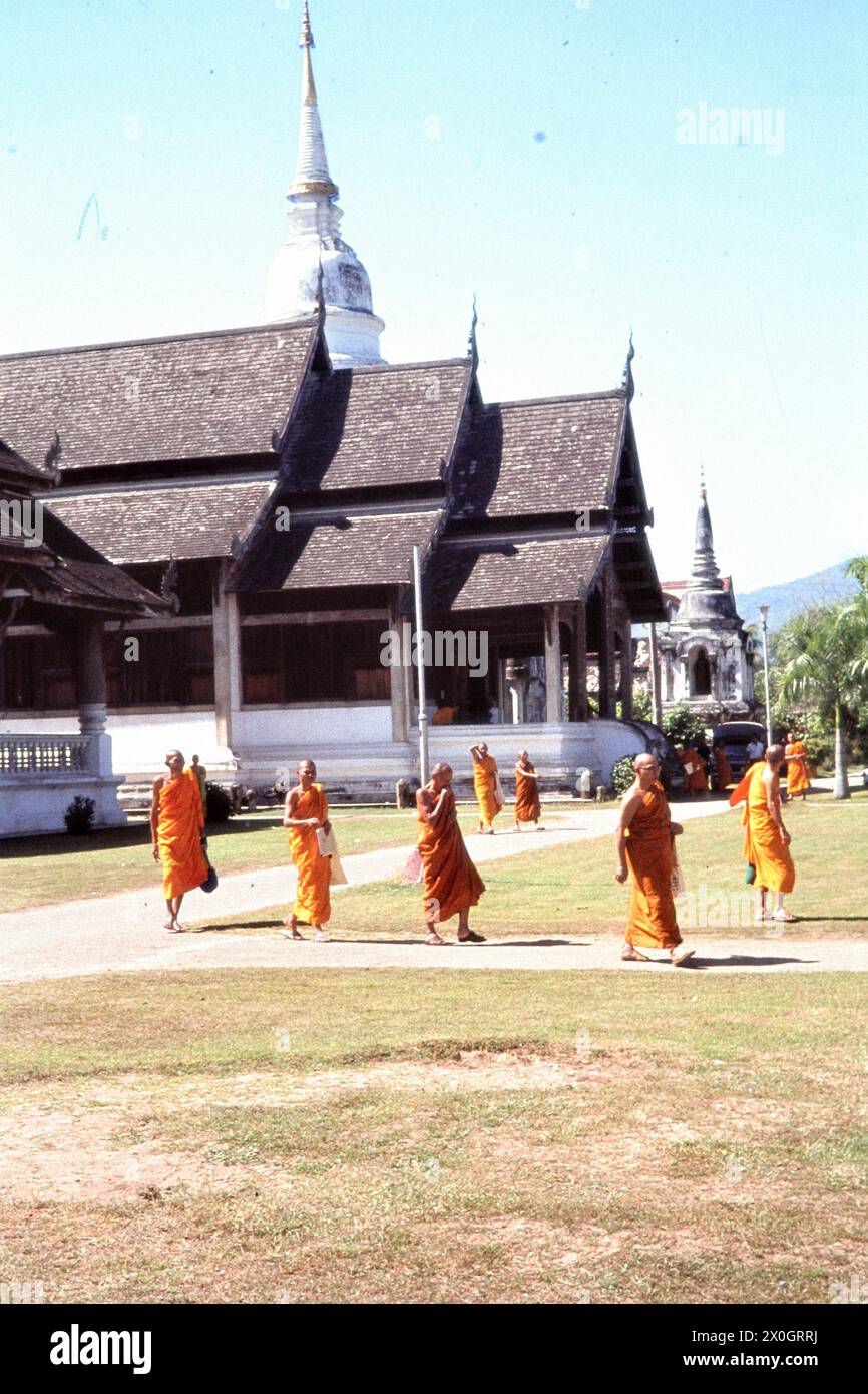 Buddhist monks in front of a Vihara monastery in Chiang Mai. [automated ...