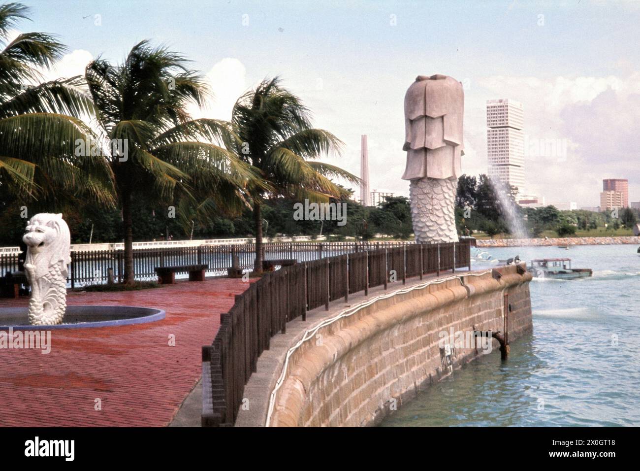 The statue of the Merlion mythical creature (half fish, half lion) on a ...