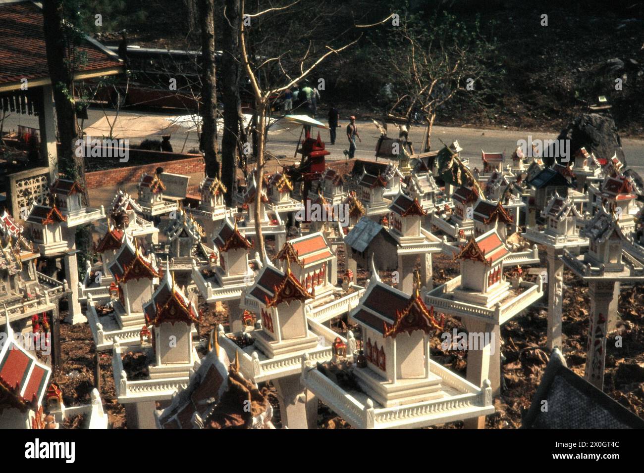 Lined up ghost houses (San Phra Phum) in the village of Pratu Pa, about ...