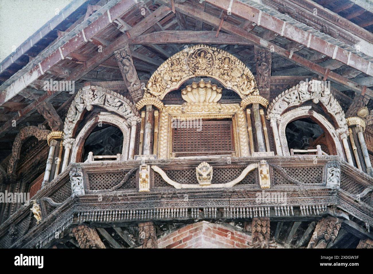 Window of the royal palace at the Makhan Toles in Kathmandu with gold ...
