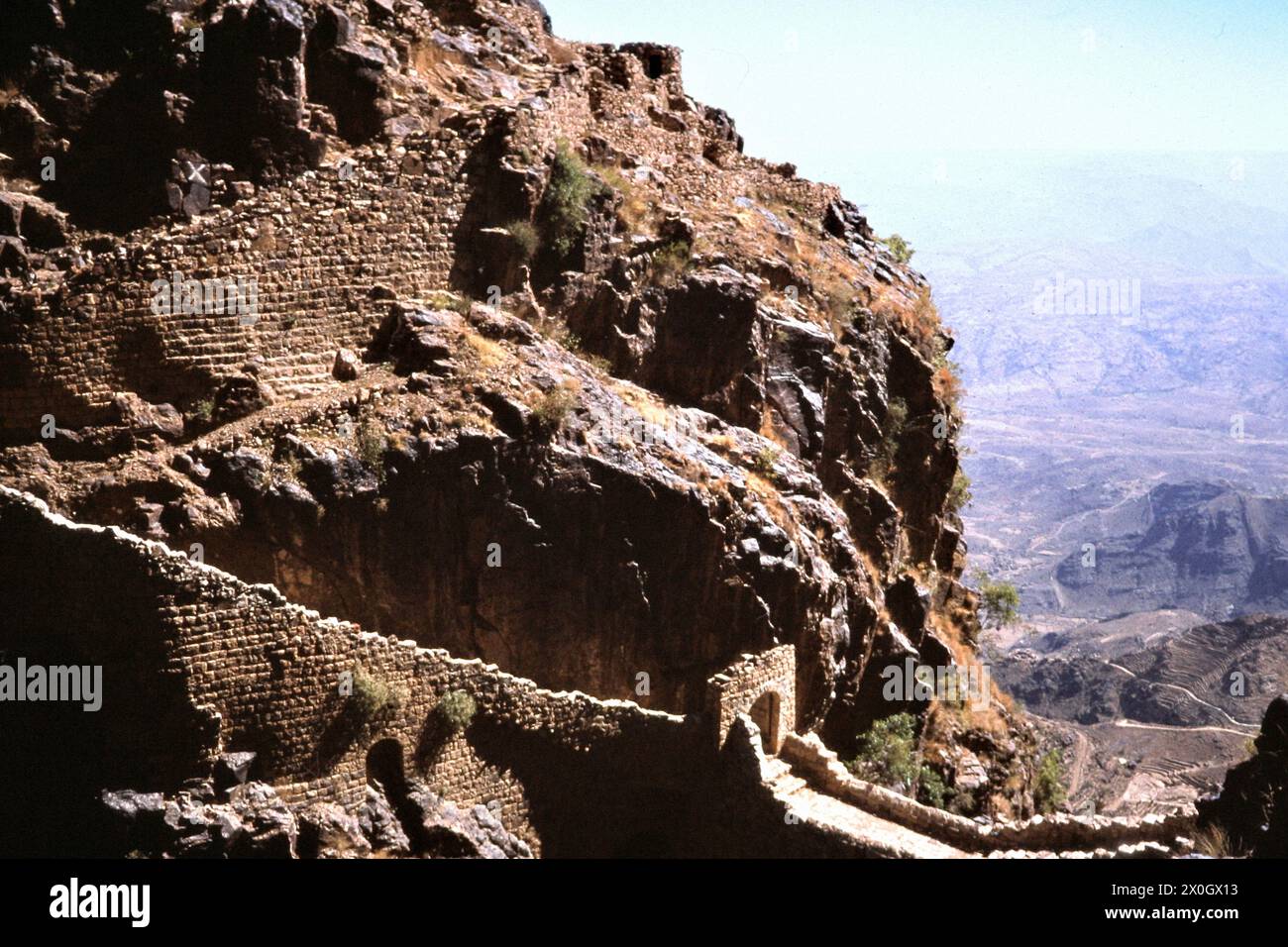 A stone bridge from the 17th century over a gorge in the mountains near ...