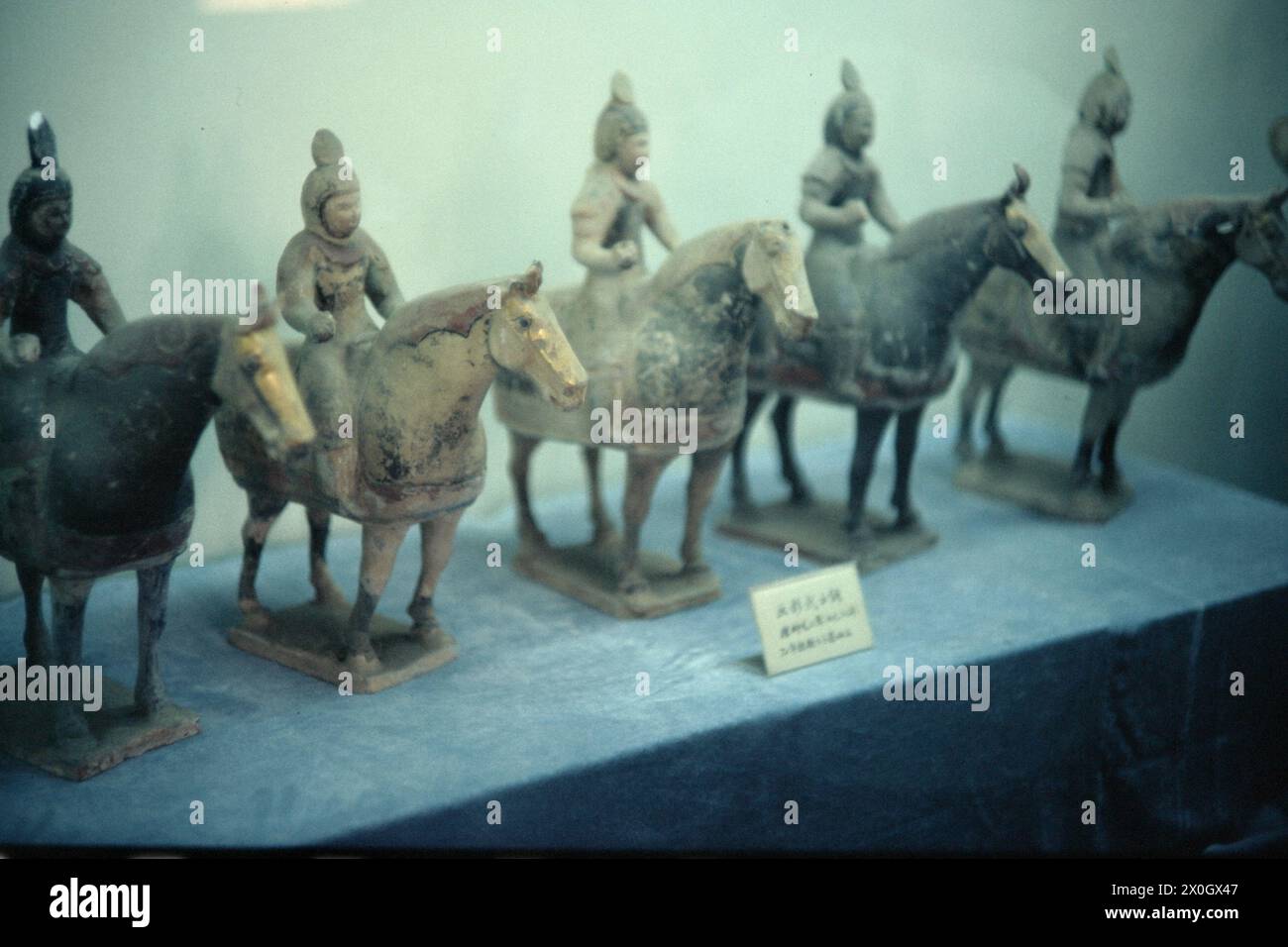 Cavalry figures from the Tang dynasty in a museum in Xi'an. [automated ...