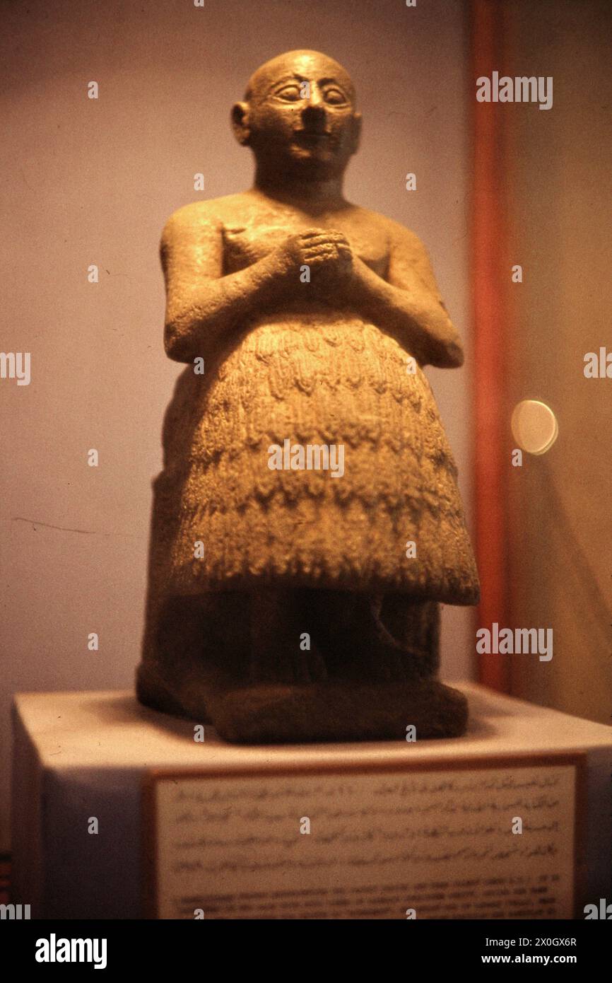 A statue of a high priest from about 2600 BC in a museum in Baghdad ...