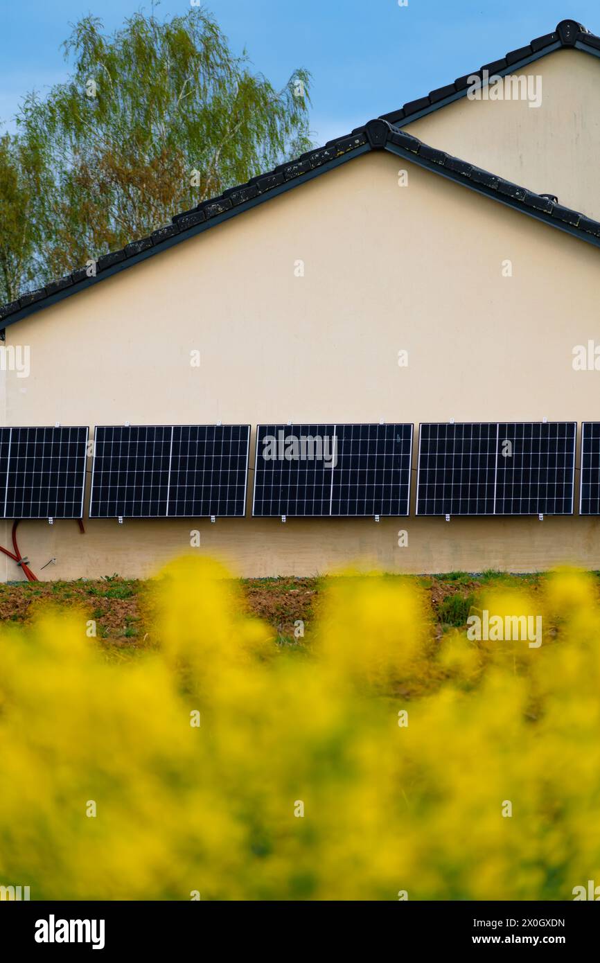 Solar panels on a well-exposed wall of an individual house, making ...