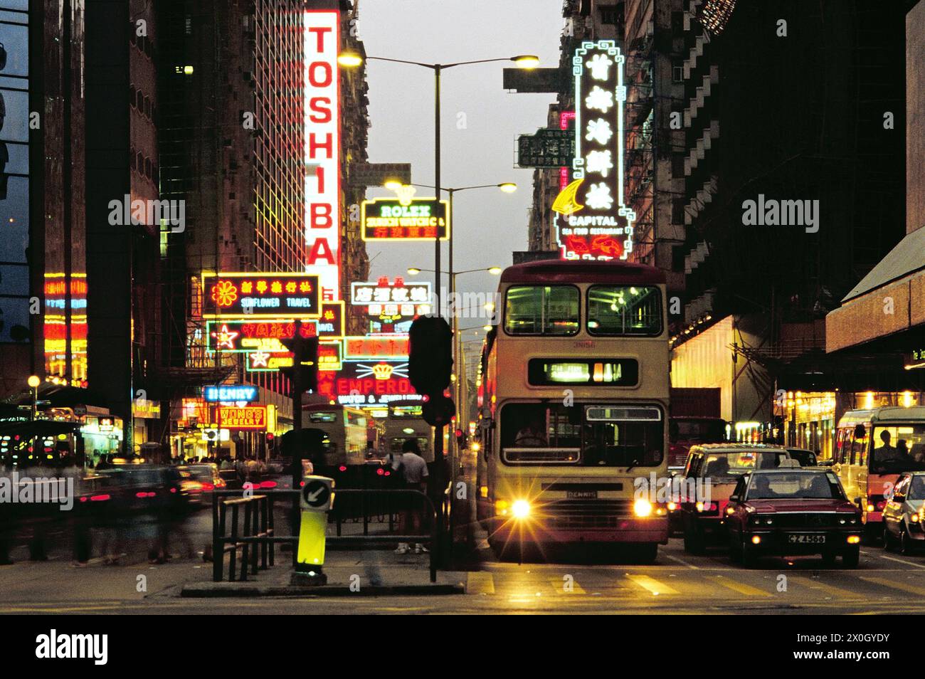 Neon signs and traffic on Nathan Road in Kowloon District of Hong Kong ...