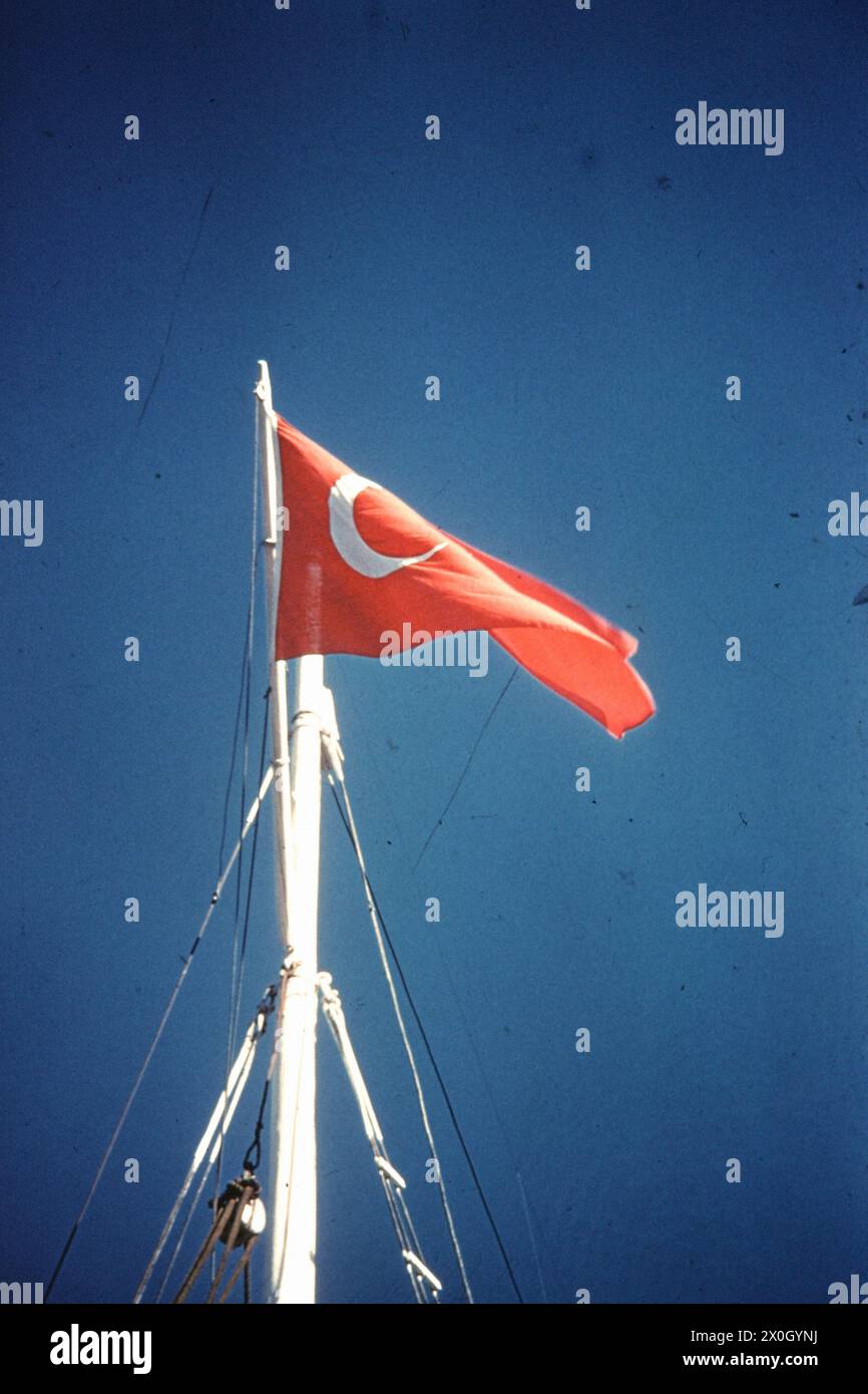 Turkish national flag on the mast of a ship in Istanbul port ...