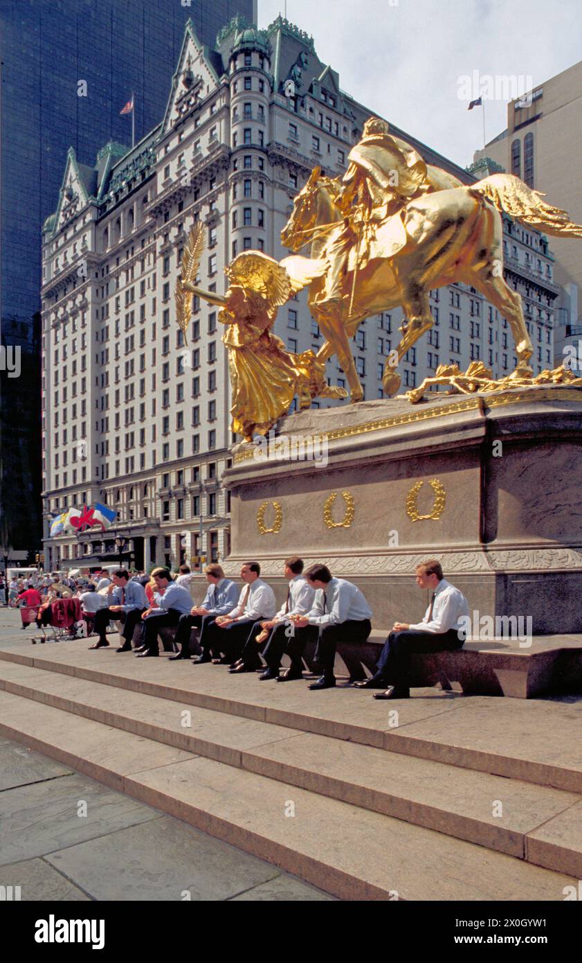 Some men take a lunch break at Grand Army Plaza under the statue of General William Tecumseh ...