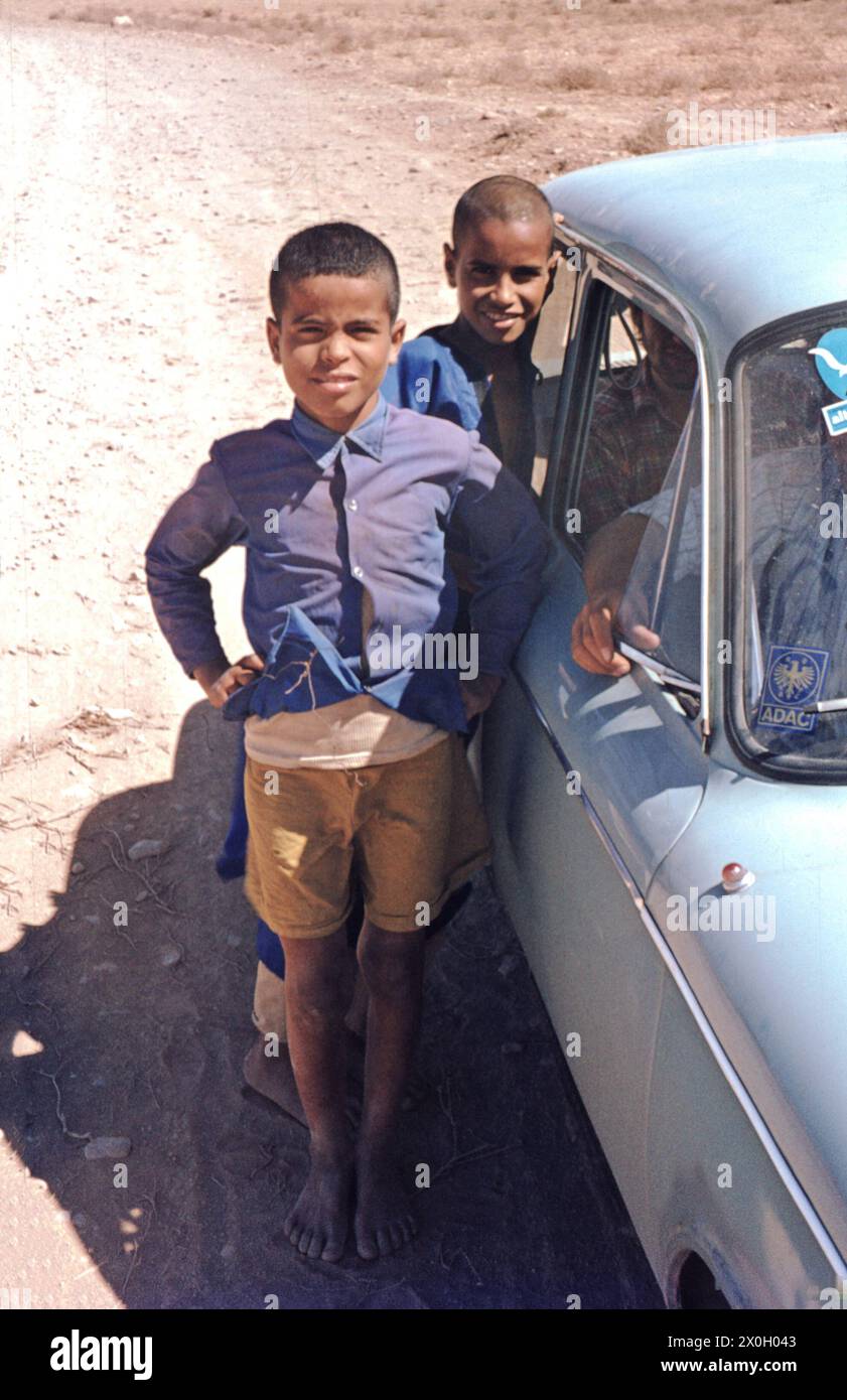 Children lean against an NSU prince south of Guelmim in Morocco and ...