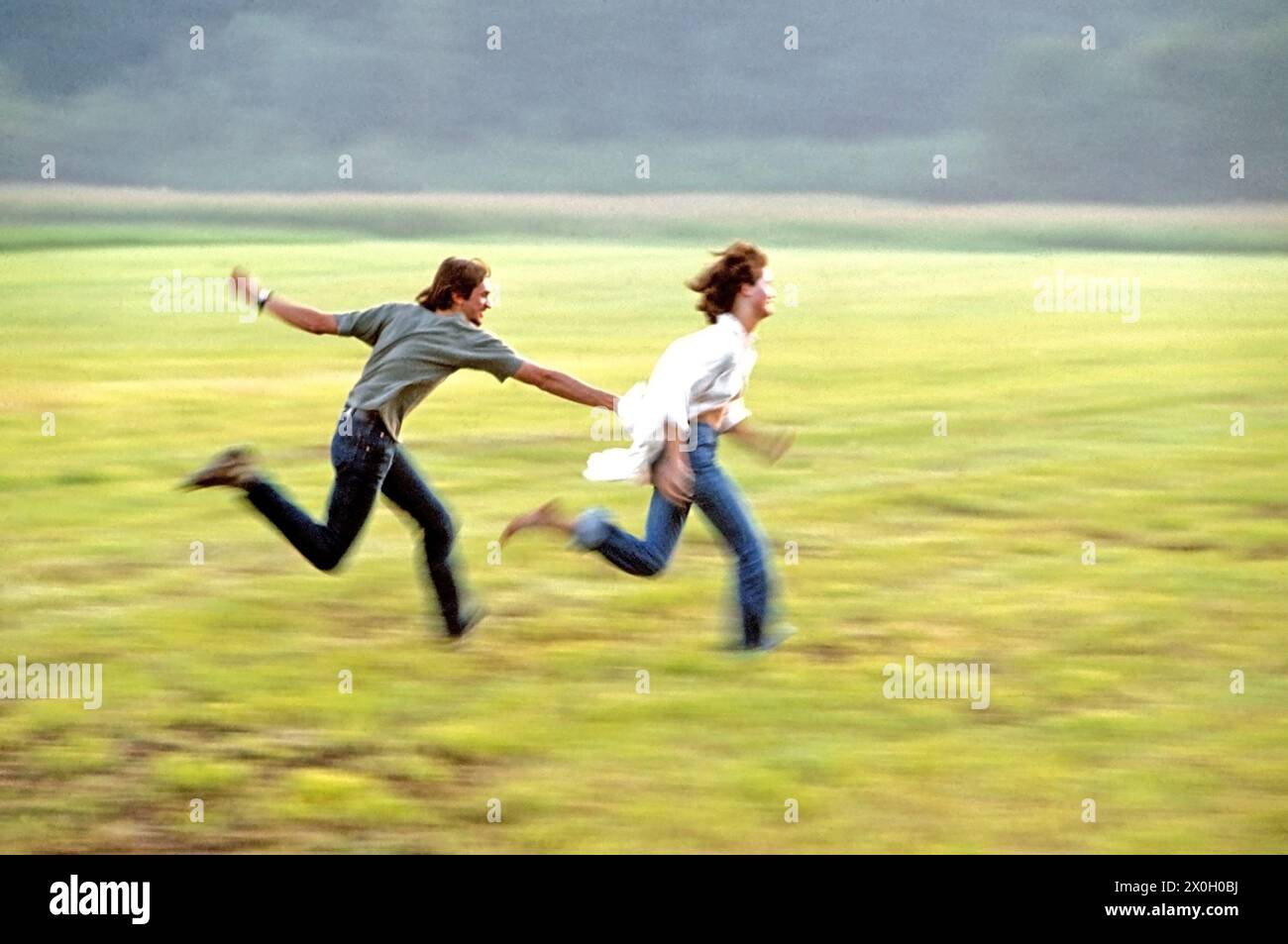 Young man running after young woman in game. [automated translation ...