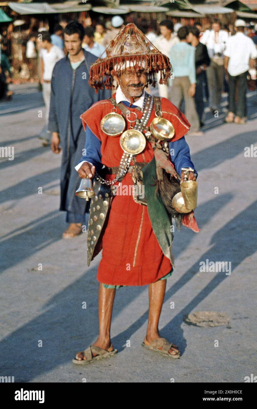 Water vendor on the juggler's square in Marrakech, Morocco [automated ...