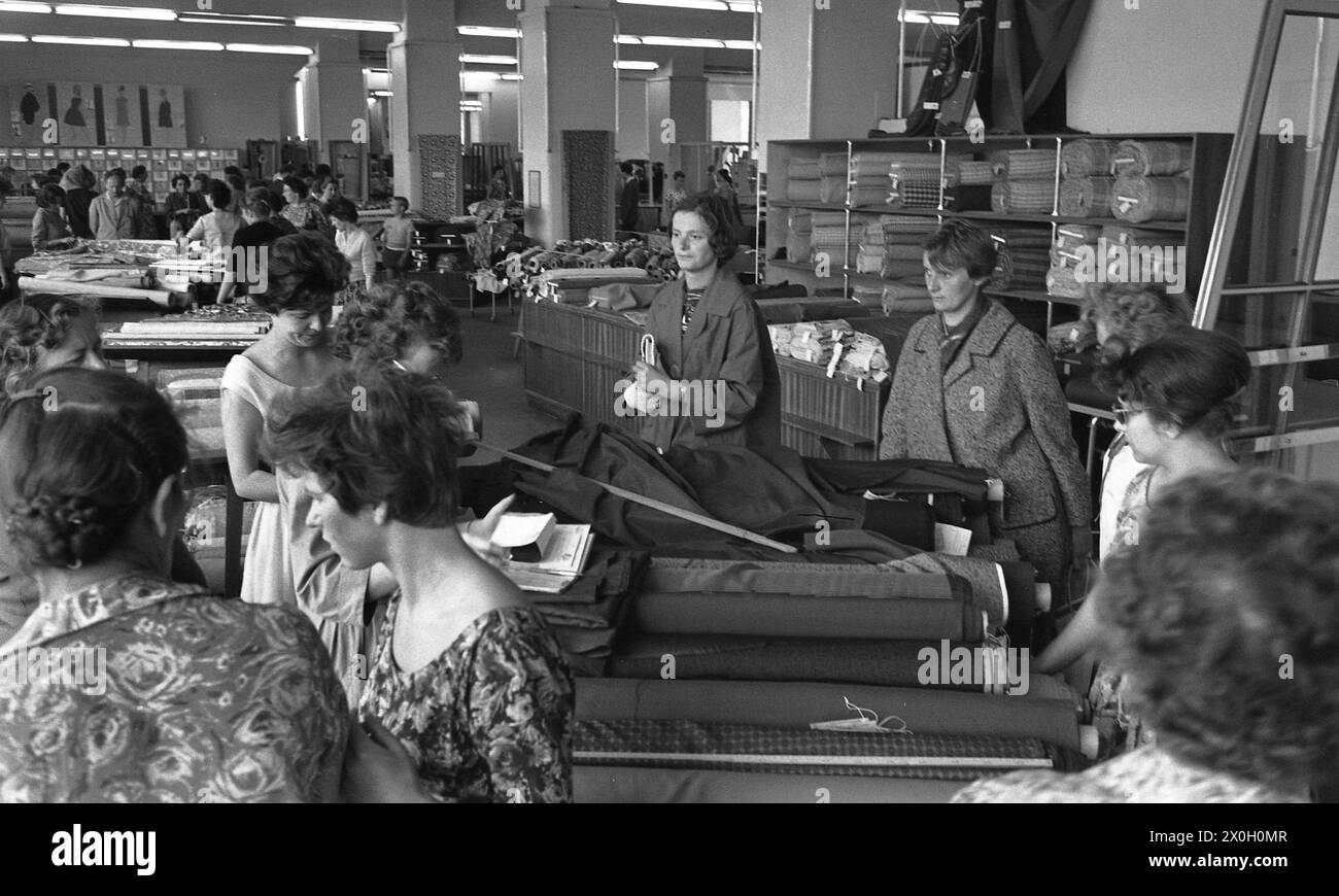 Women in the fabric department of the department store on ...
