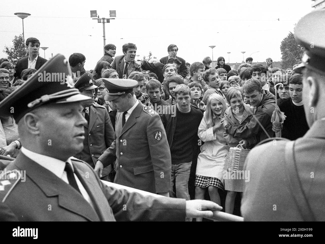 "Visitors during the Beatles concert in Essen, Germany: The police take ...