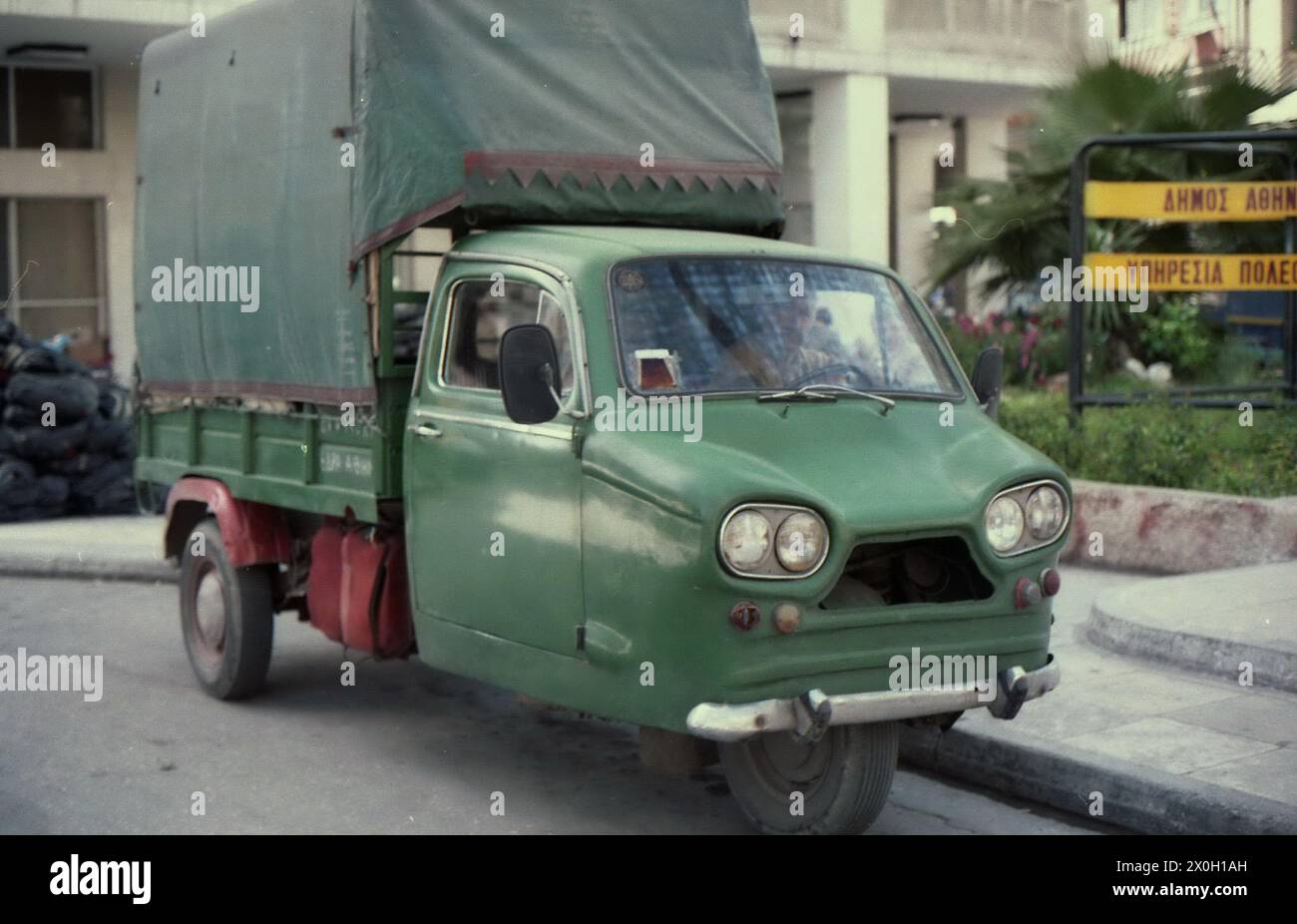 Mini van with three wheels in Athens Stock Photo - Alamy