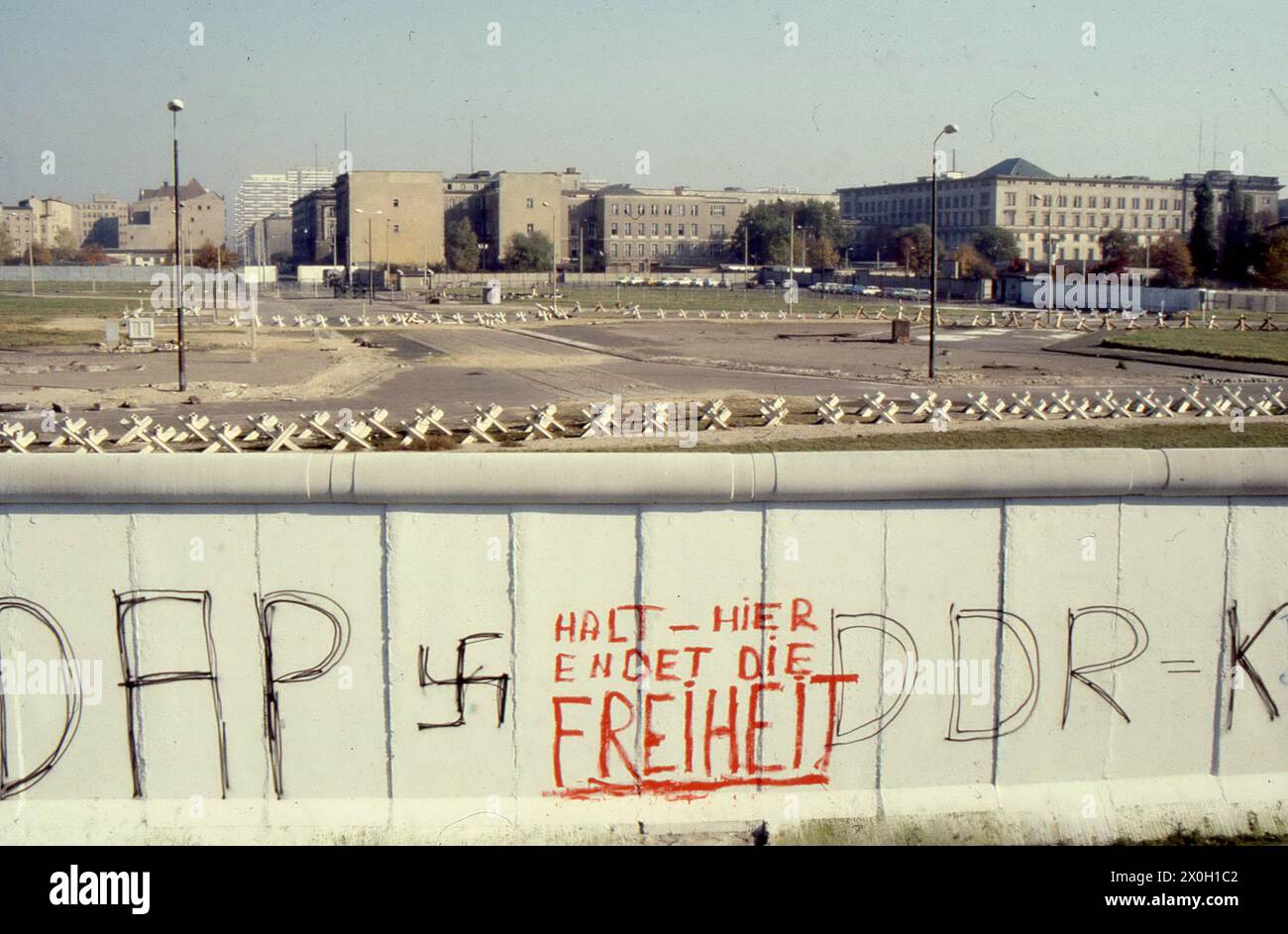 The Berlin Wall on Potsdamer Platz with tank traps and the words 'DAP ...